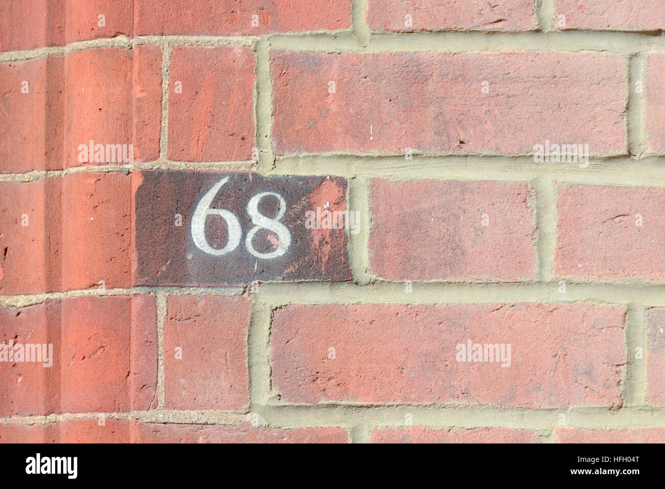House Number 68 painted sign on wall Stock Photo - Alamy