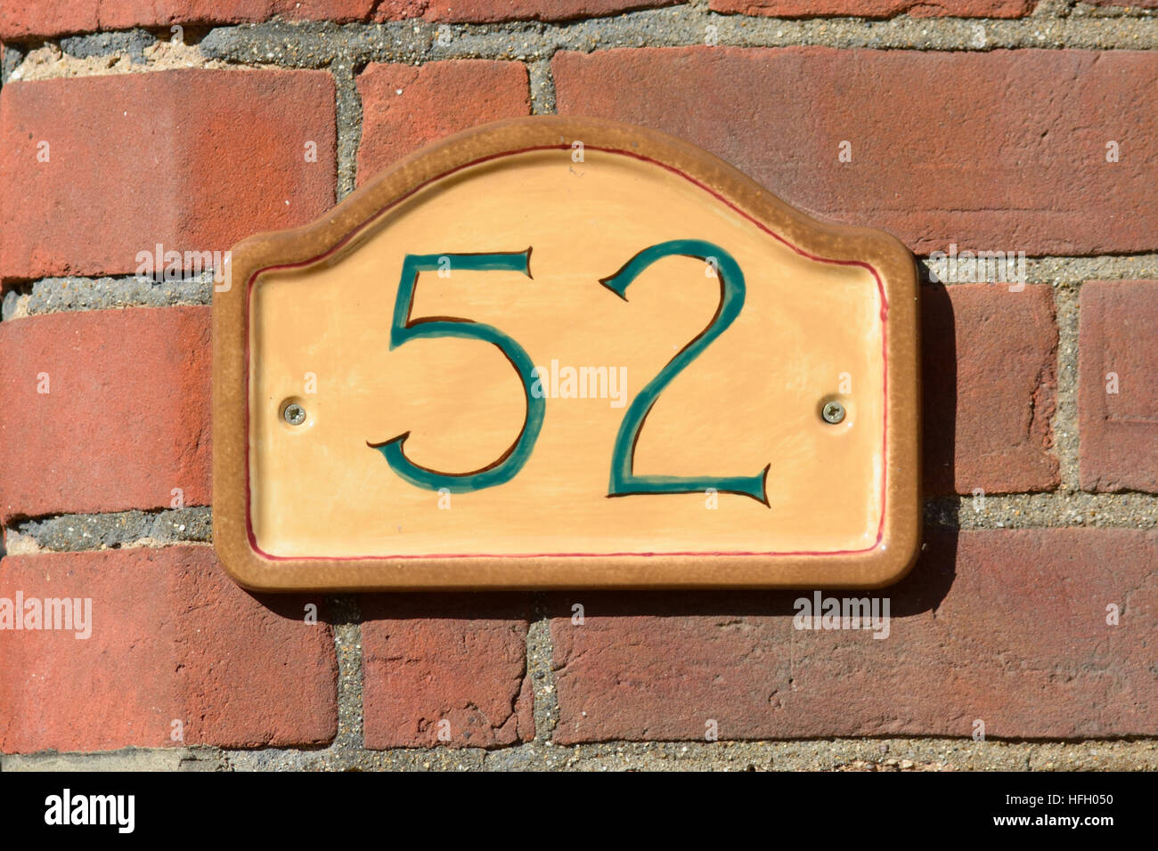 House Number 52 sign on wall Stock Photo - Alamy