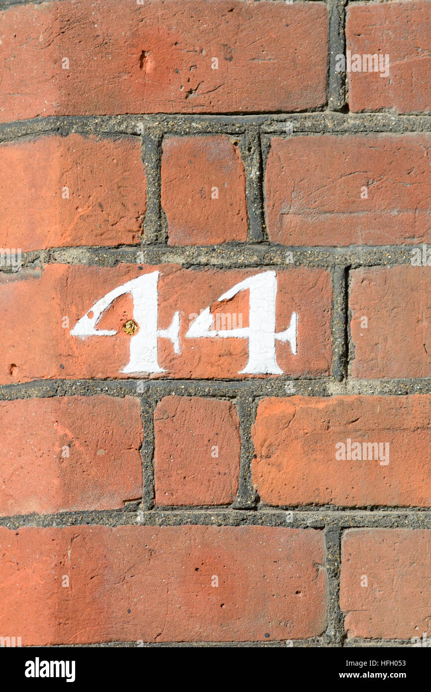 House Number 44 painted sign on wall Stock Photo - Alamy