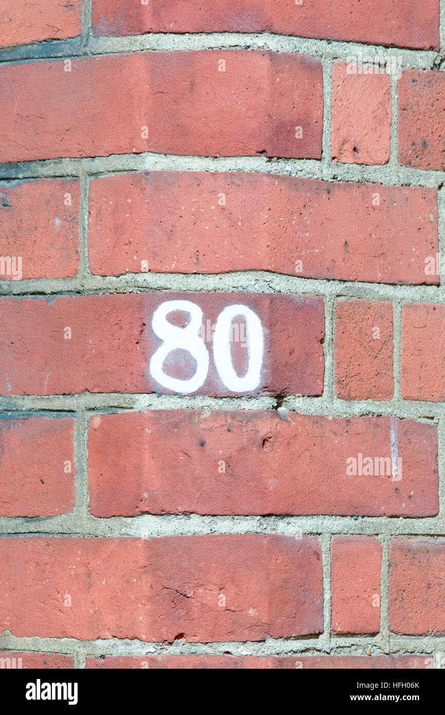 House Number 80 painted sign on wall Stock Photo - Alamy
