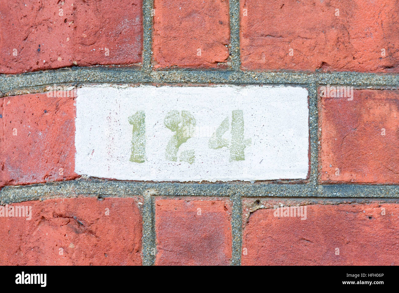 House Number 124 painted sign on wall Stock Photo - Alamy