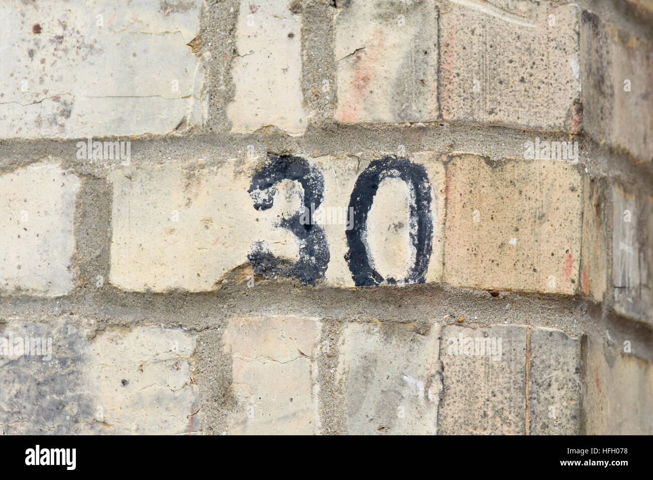 House Number 30 painted sign on wall Stock Photo - Alamy