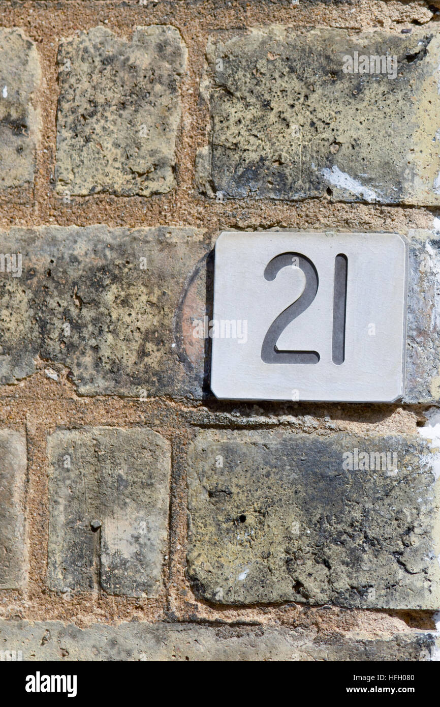 House Number 21 sign on wall Stock Photo - Alamy