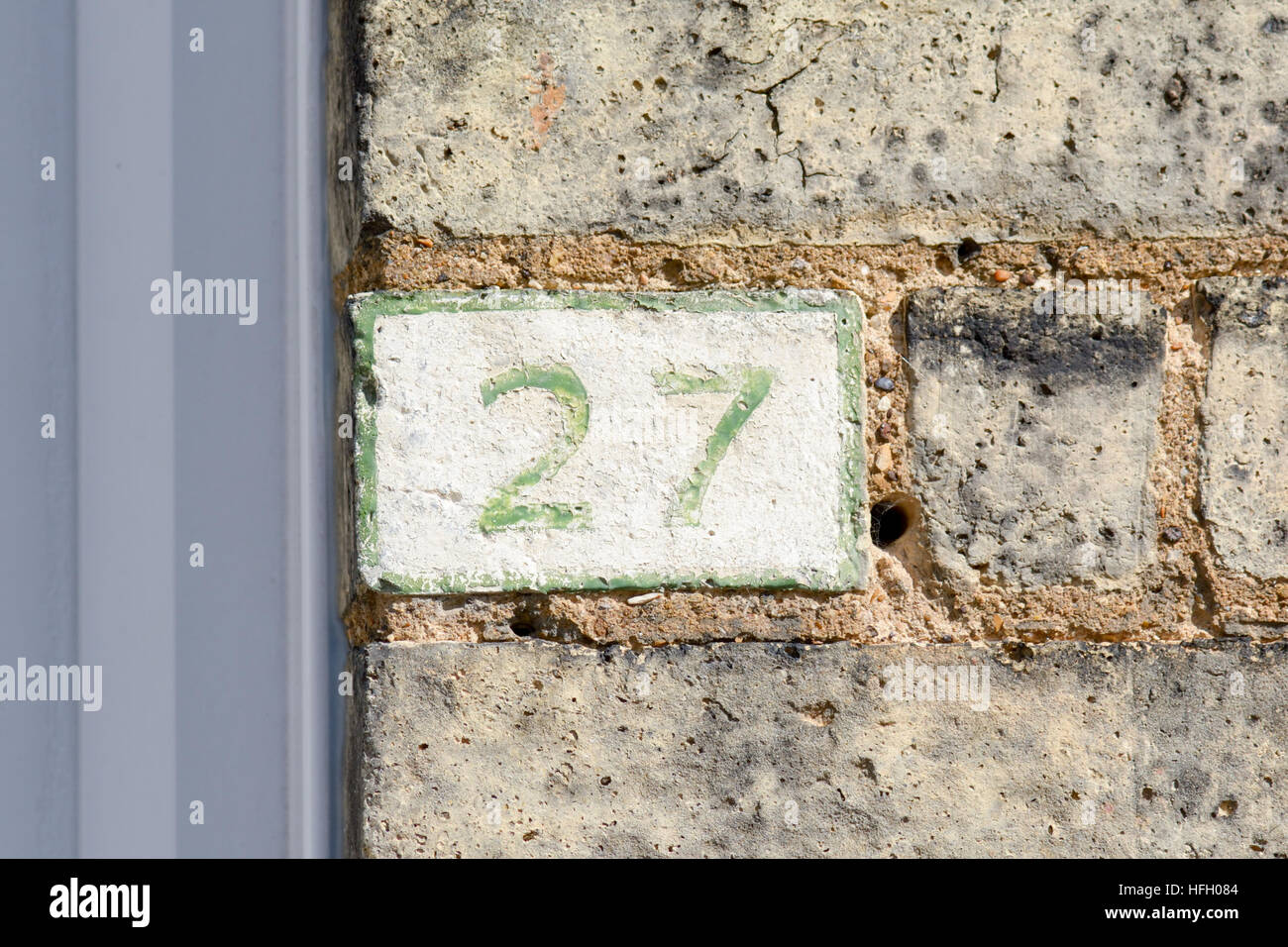 House Number 27 painted sign on wall Stock Photo - Alamy