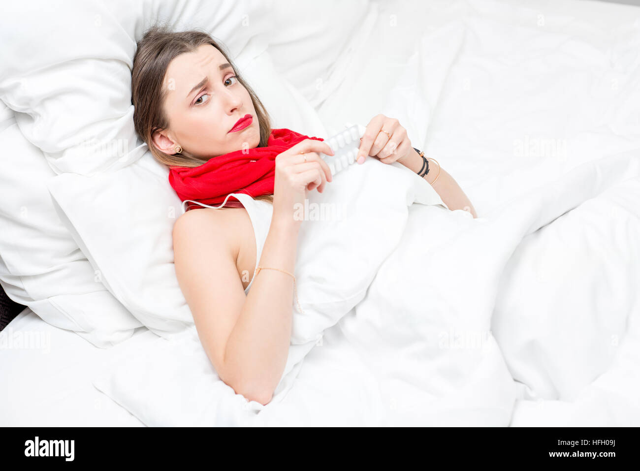 Sick woman in bed Stock Photo - Alamy
