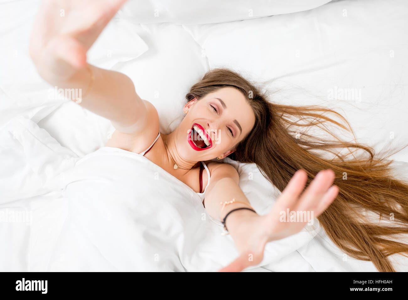 Woman waking up Stock Photo - Alamy