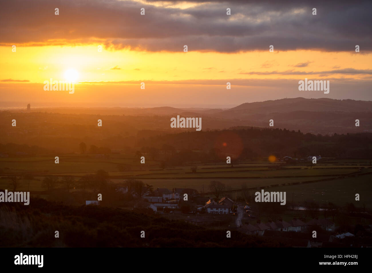 Sunrise over a rural welsh landscape near to the village of Rhosesmor ...