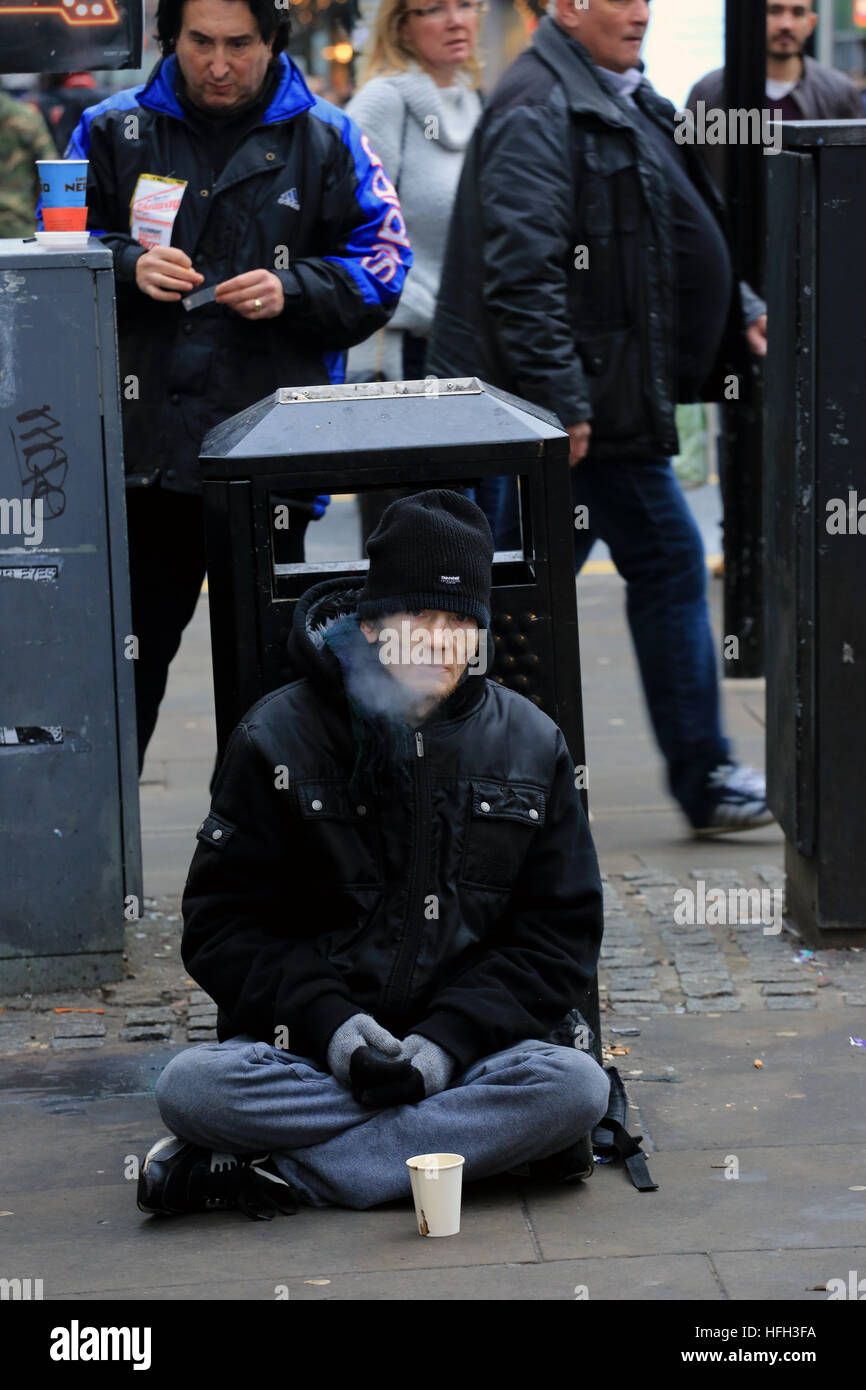 Beggar sitting roadside beggar hi-res stock photography and images - Alamy