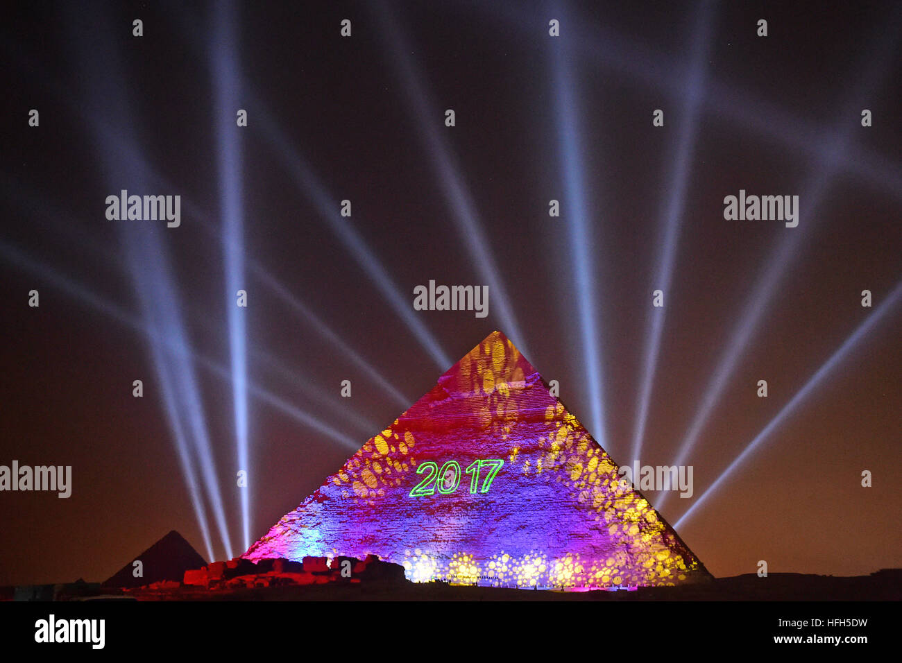 Giza, Egypt. 31st Dec, 2016. The Khafre Pyramid is lit during New Year ...
