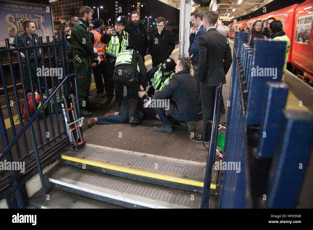 London, UK. 1st January 2017. A drunken man is dragged by police ...
