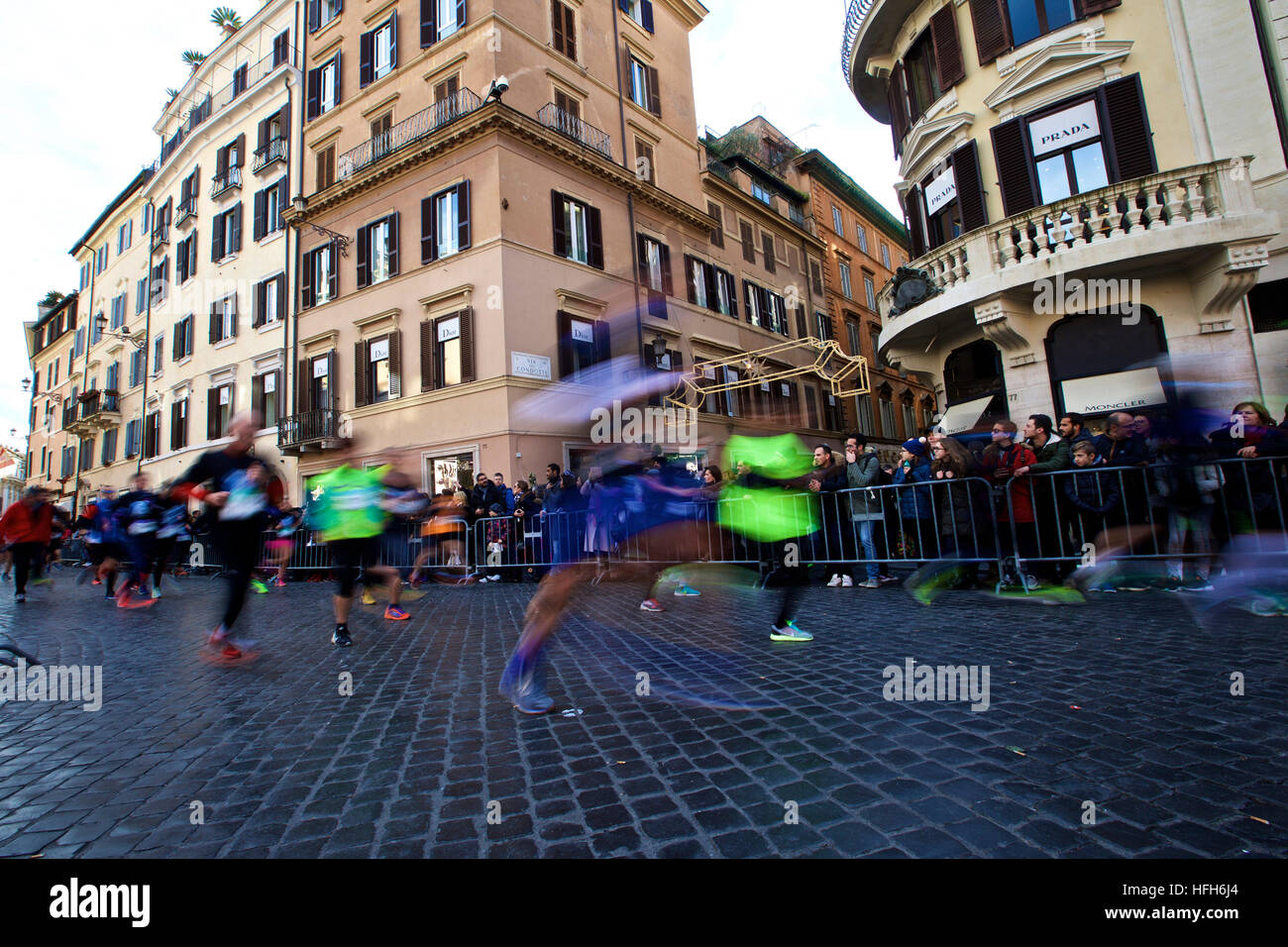 Rome, Italy. 31st Dec, 2016. People run past the Spanish Square during ...