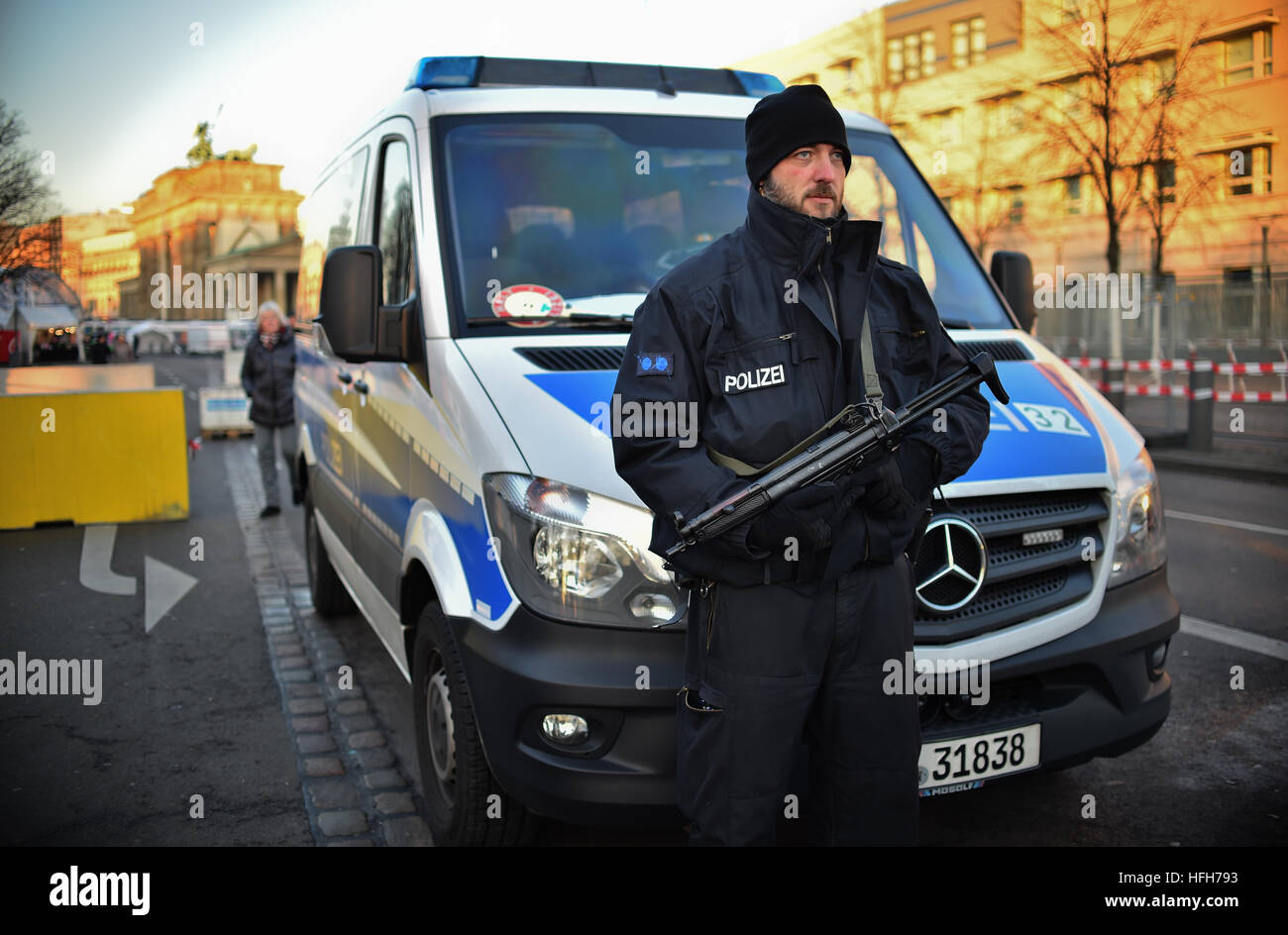 Berlin, Germany. 31st Dec, 2016. A police officer stands at the ...