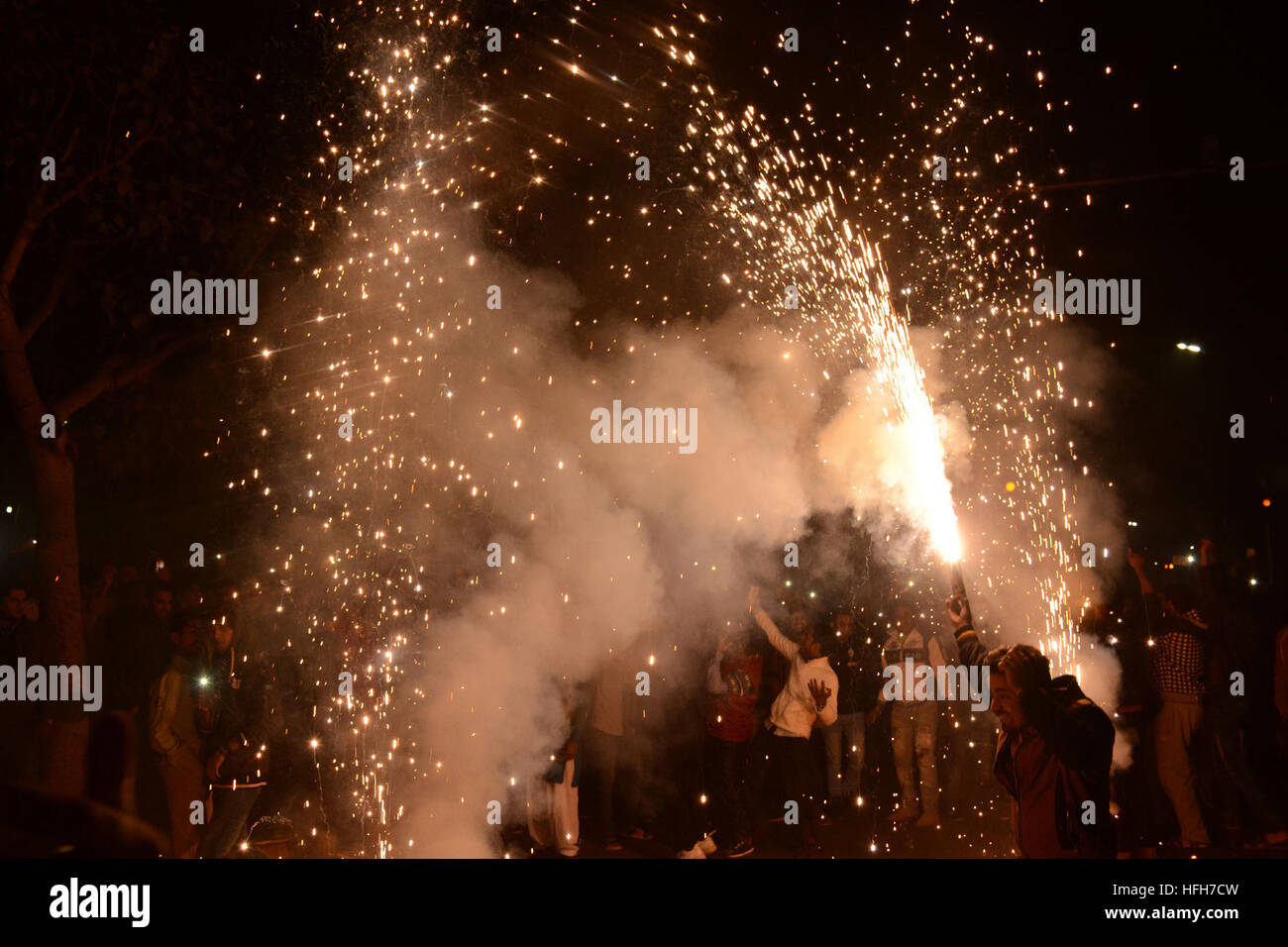 Lahore. 1st Jan, 2017. Pakistani youth set off firecrackers as they ...