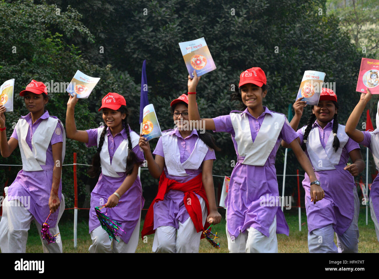 Bangladeshi School students rise up textbook during the Textbook ...