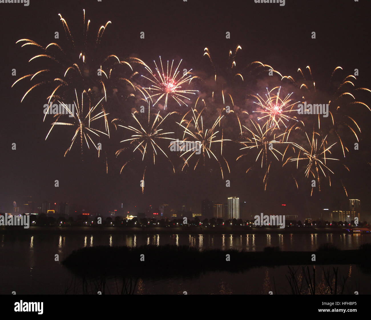 Changsha, China's Hunan Province. 1st Jan, 2017. Fireworks paint the ...