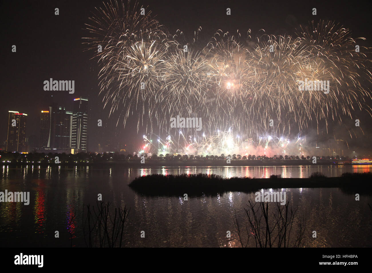 Changsha, China's Hunan Province. 1st Jan, 2017. Fireworks paint the ...