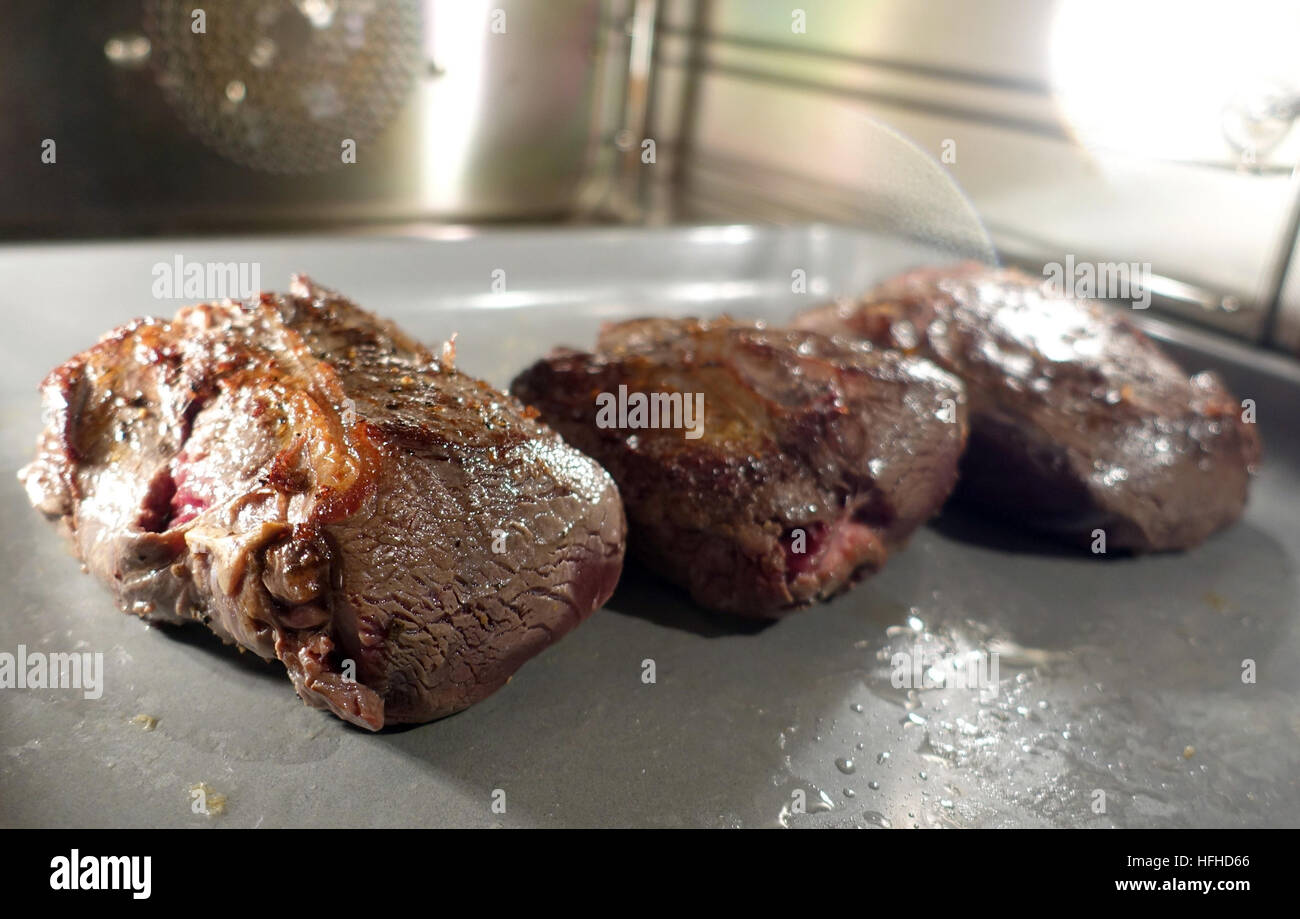 Three pieces of deer fillet cooking in the oven, as seen on 24 December ...