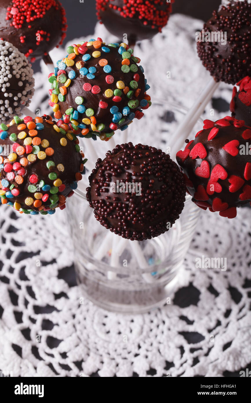 Beautiful chocolate cake pops with candy sprinkles close-up on the ...