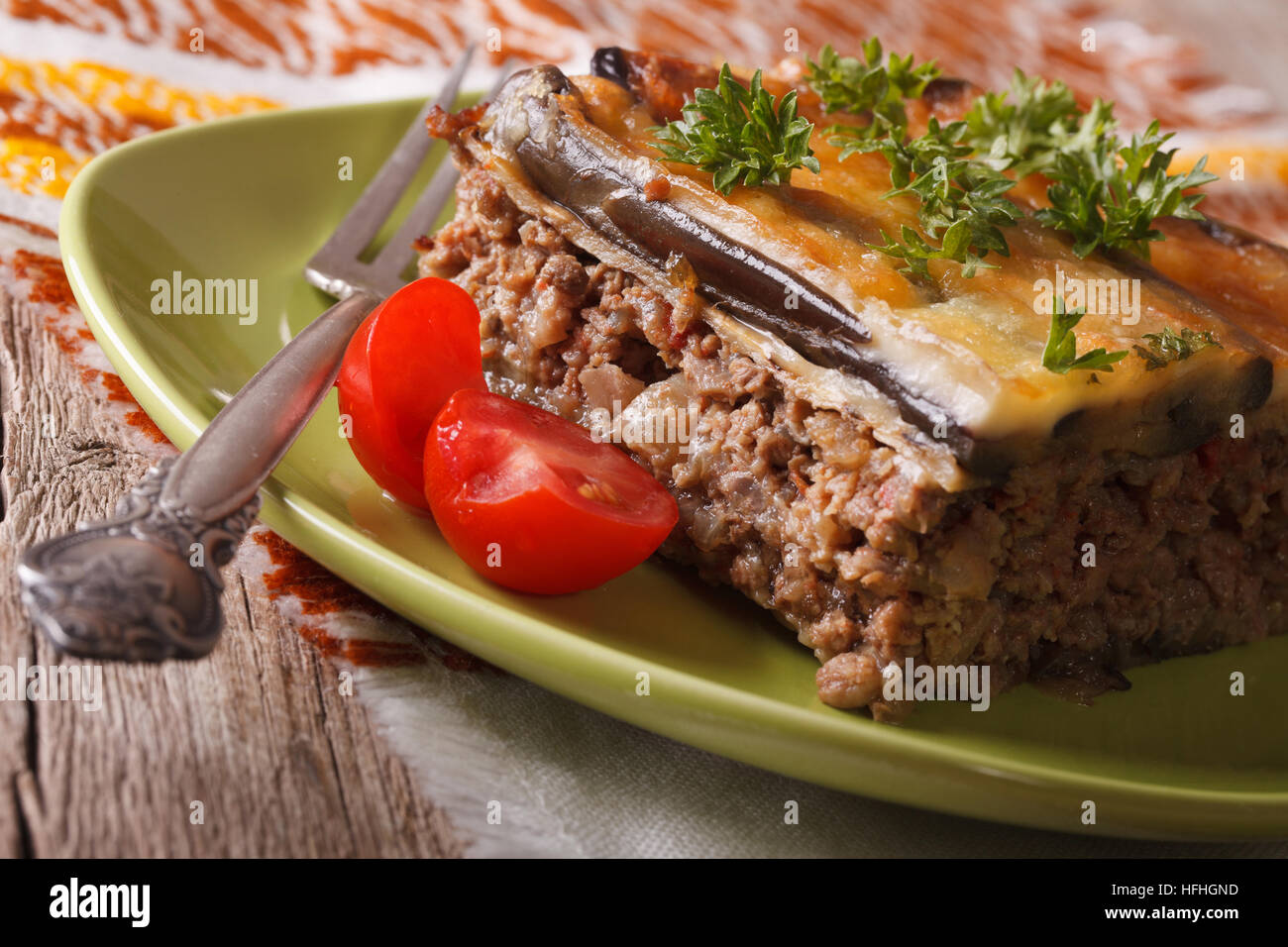 Homemade Greek moussaka on the green plate close-up. horizontal Stock ...