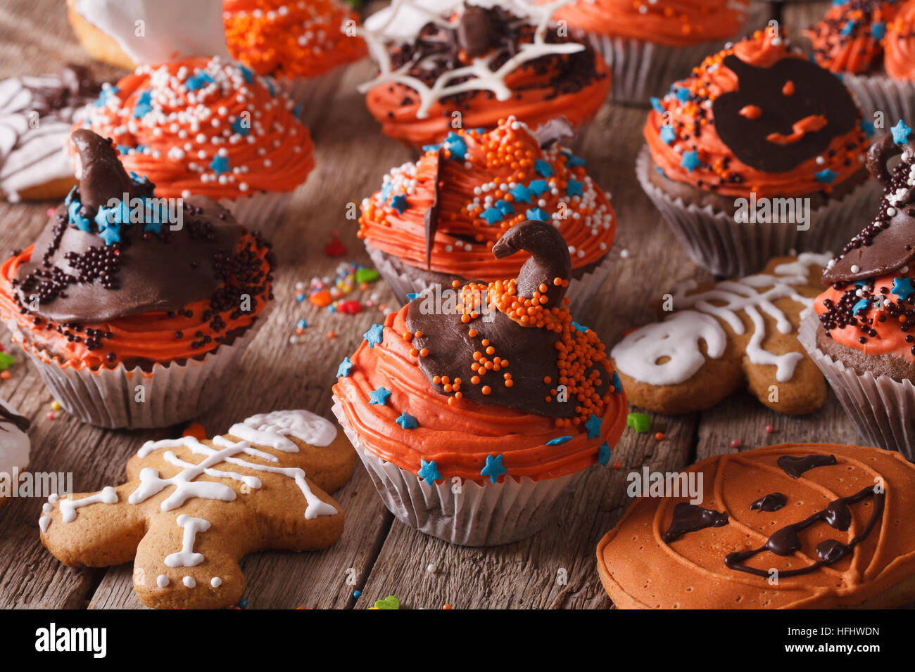 Halloween cupcakes and gingerbread cookies close-up on the table ...