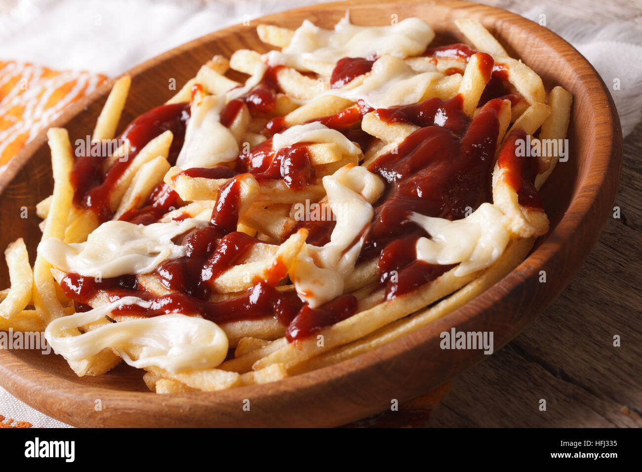 poutine with sauce and cheese macro on the table. Horizontal Stock ...
