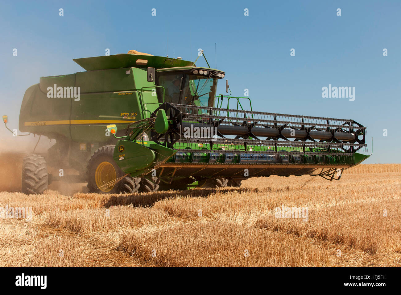 Crop harvesting with modern farm equipment Stock Photo - Alamy