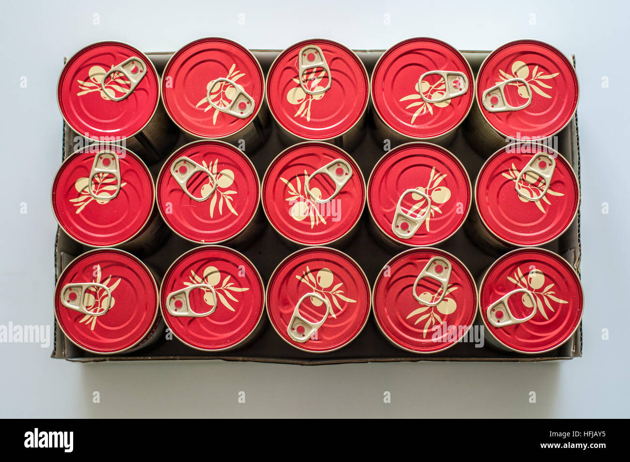 Canned olives in a red can Stock Photo - Alamy