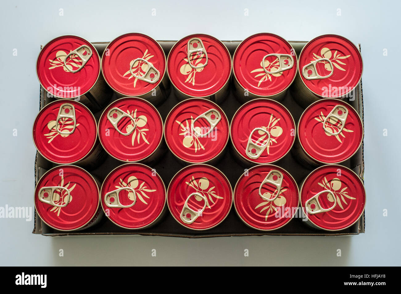 Canned olives in a red can Stock Photo - Alamy