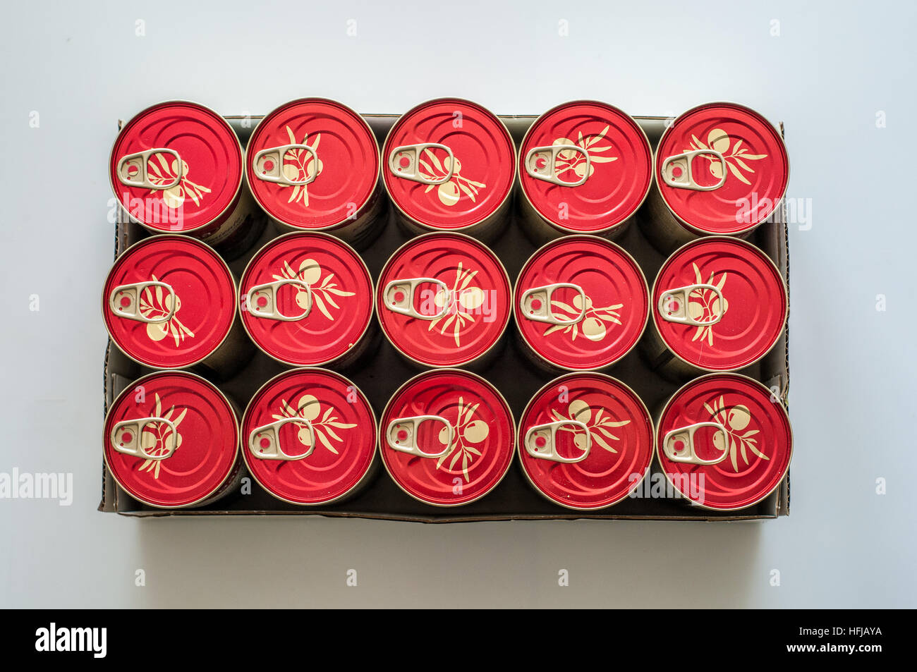 Canned olives in a red can Stock Photo - Alamy