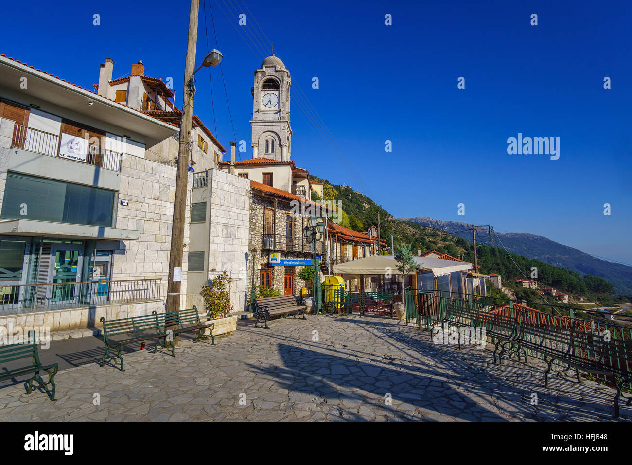 Traditional houses of Dimitsana village against a cloudy sky. Arcadia ...