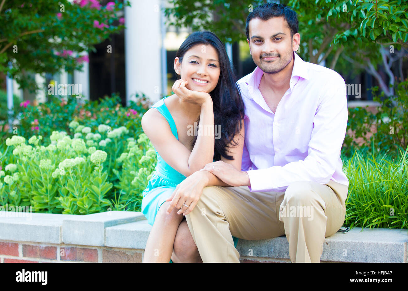 Closeup portrait, attractive wealthy successful couple in pink shirt ...
