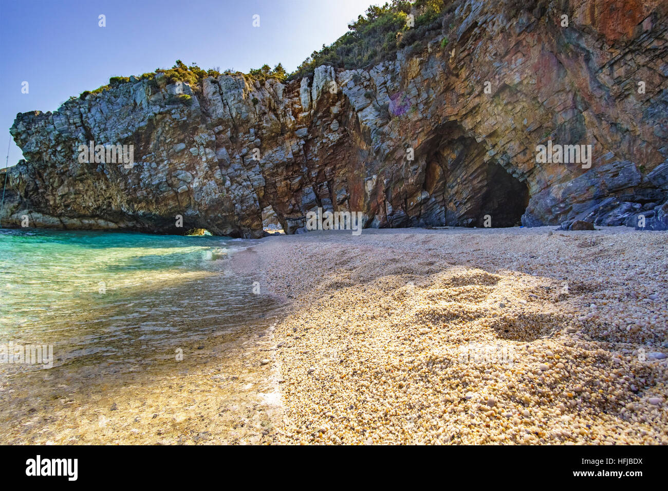 Milopotamos is a white pebbled beach with exotic crystal water of ...