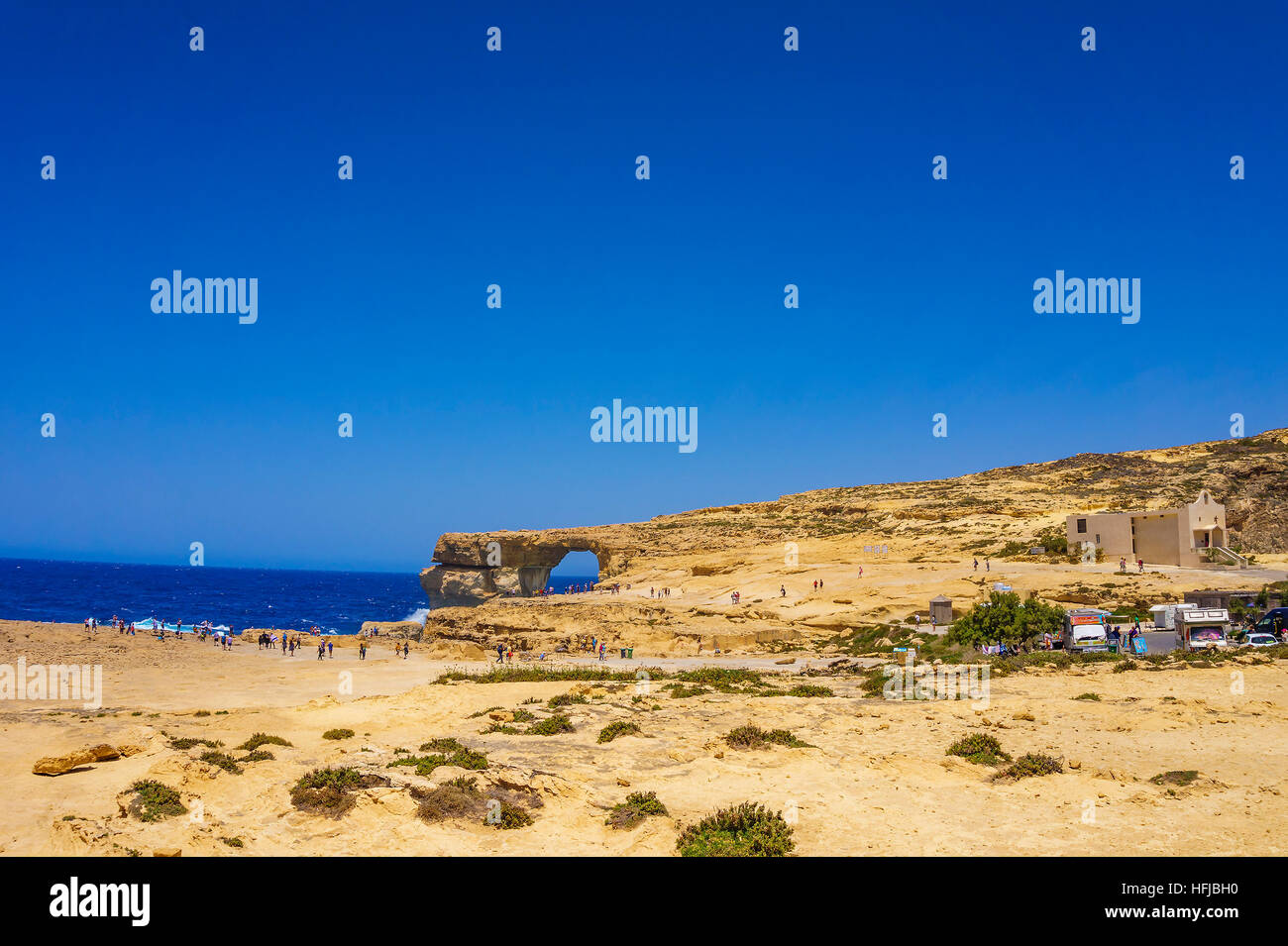 Tourists and visitors arrive to see the famous stone arch in Dwejra on ...