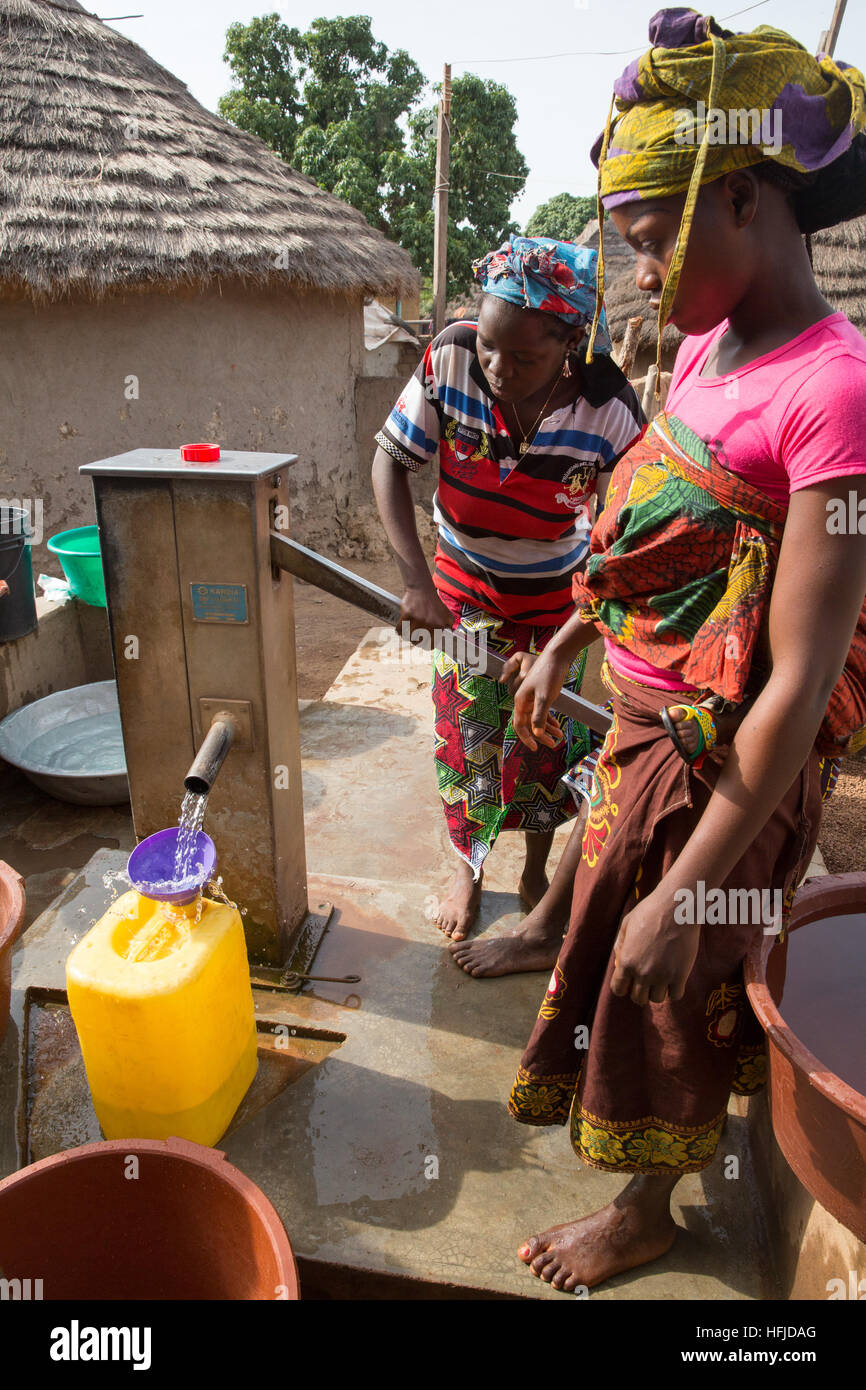 Women by water pump hi-res stock photography and images - Alamy