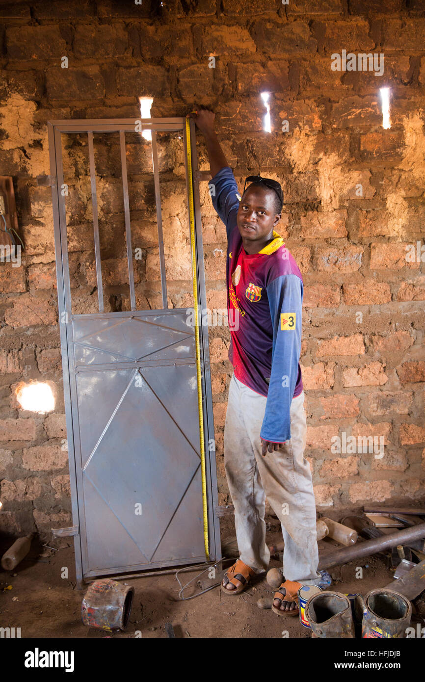 Kiniero, Guinea, 30th April 2015: Metal and welding workshop making ...