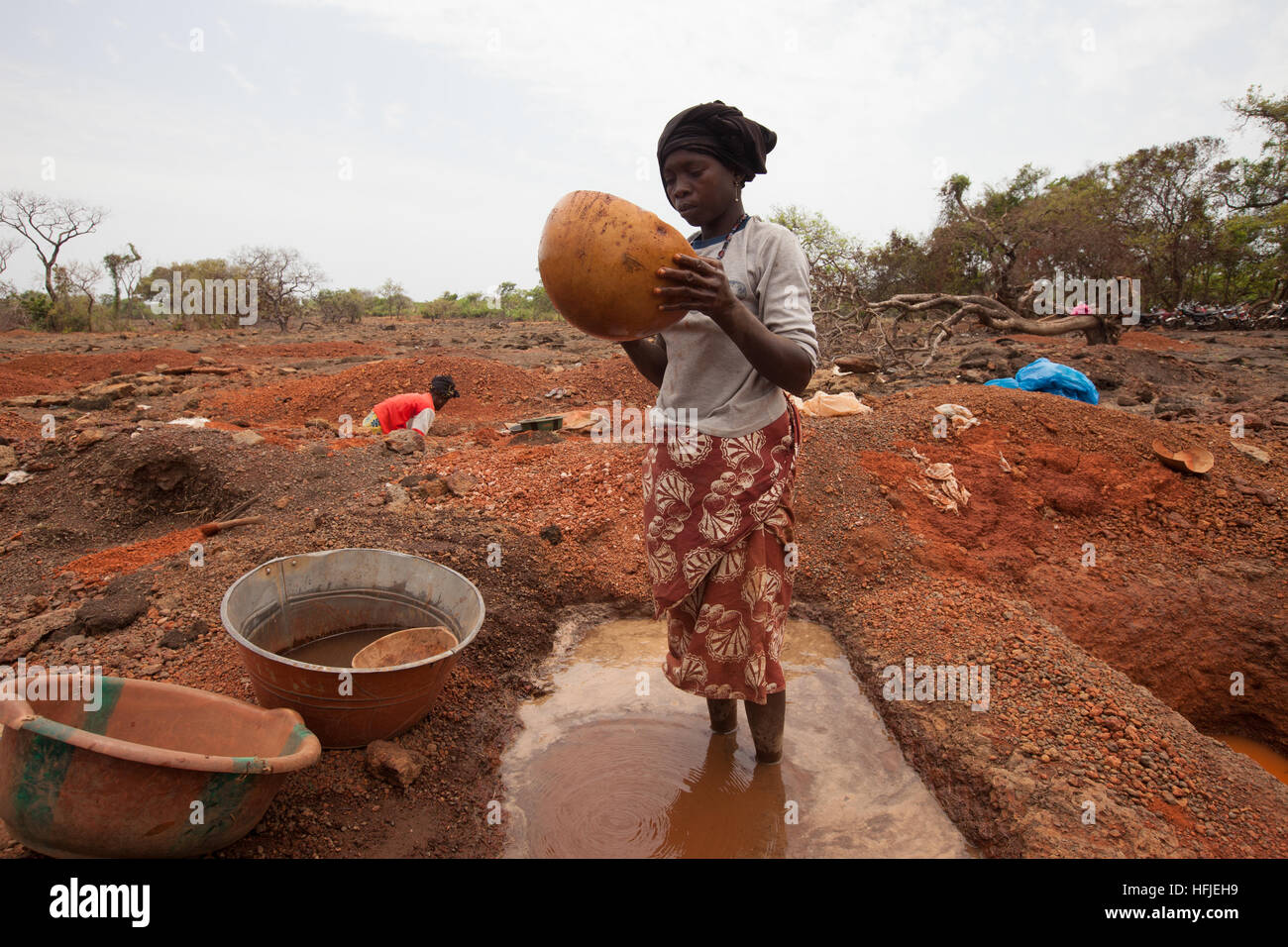 Sanana mine, Guinea, 2nd May 2015; Mariam Conde, mother of 6, collects ...