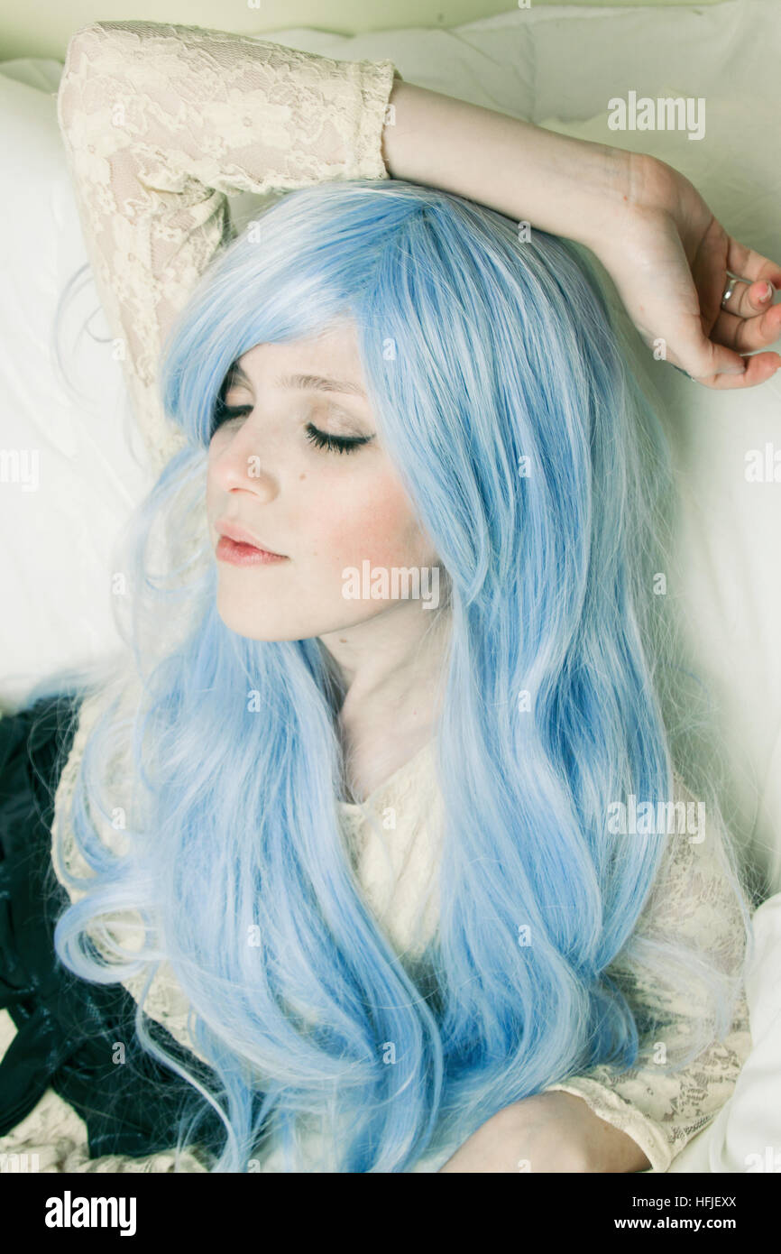 Portrait of a stylish woman with blue hair Stock Photo - Alamy