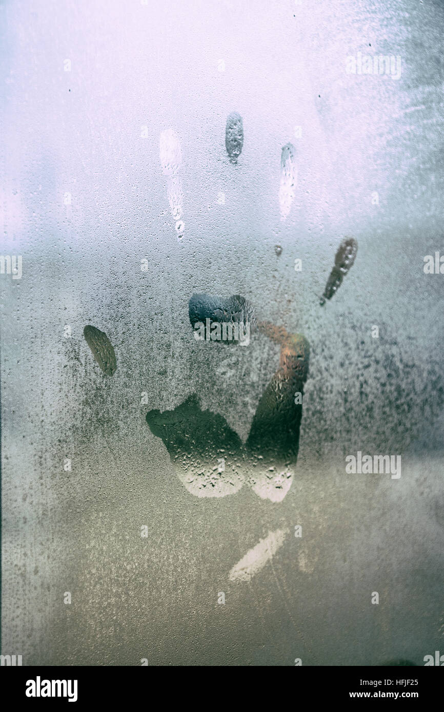 Hand print in a window Stock Photo - Alamy