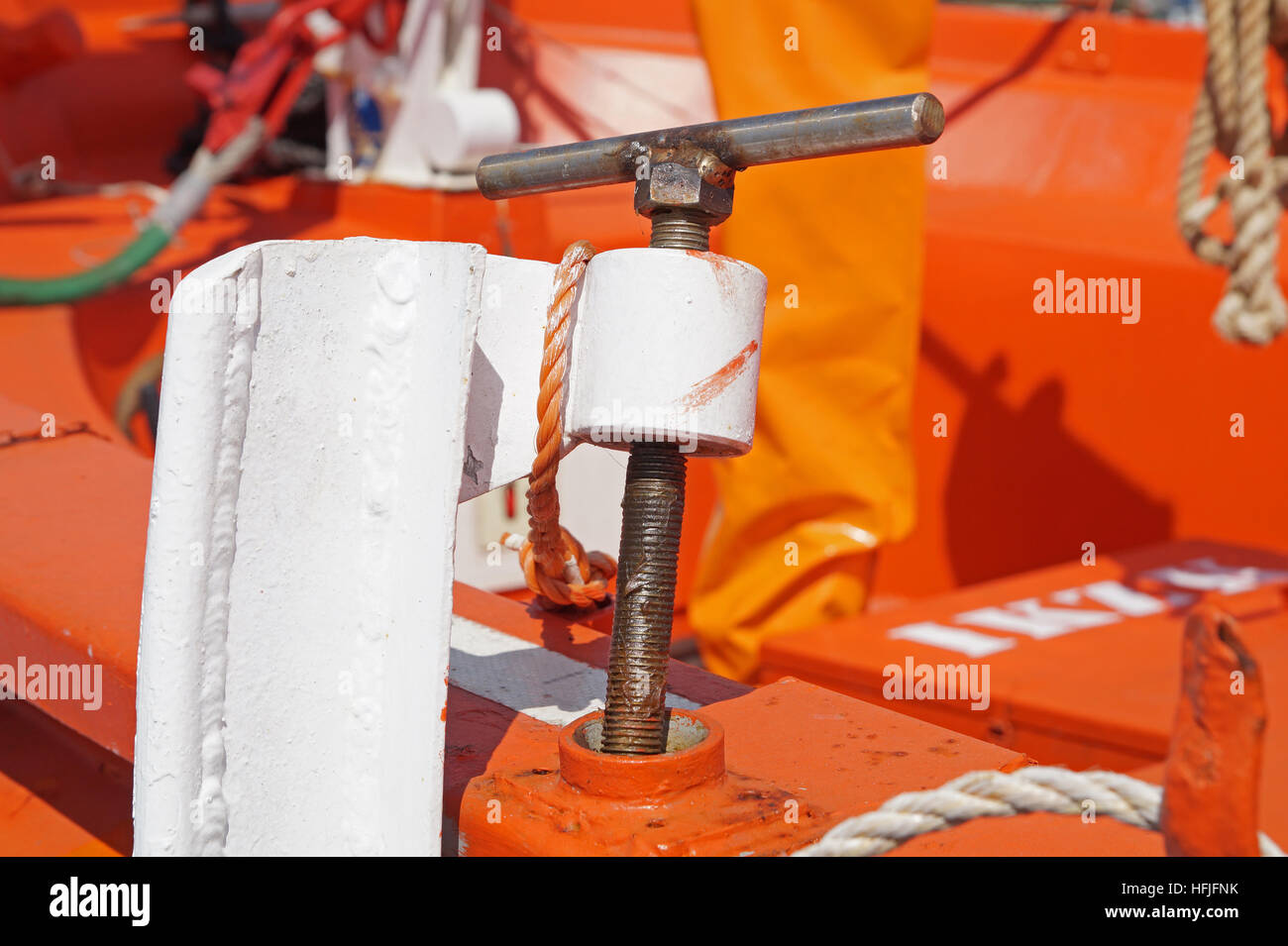 Detailed view of rope, nautical equipment with red boat background ...