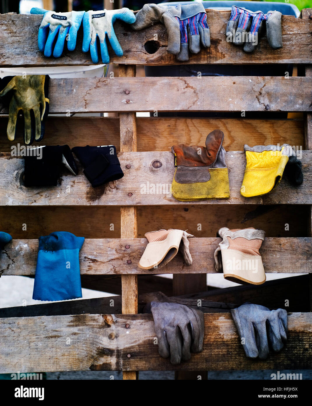 Volunteers in protective gear strip heavily molded drywall and contents ...