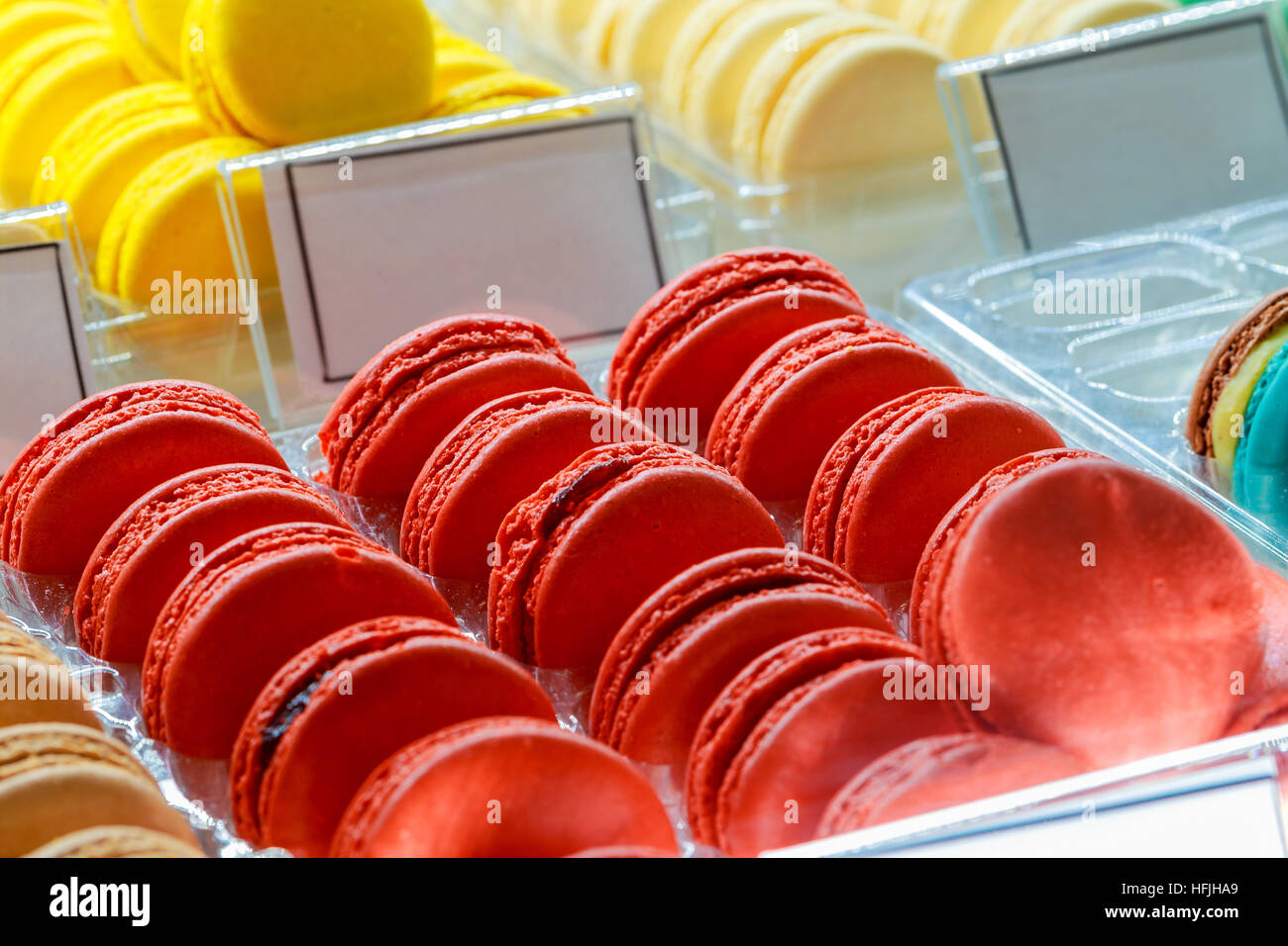 Tasty french macarons on a wooden table with vintage color tone ...
