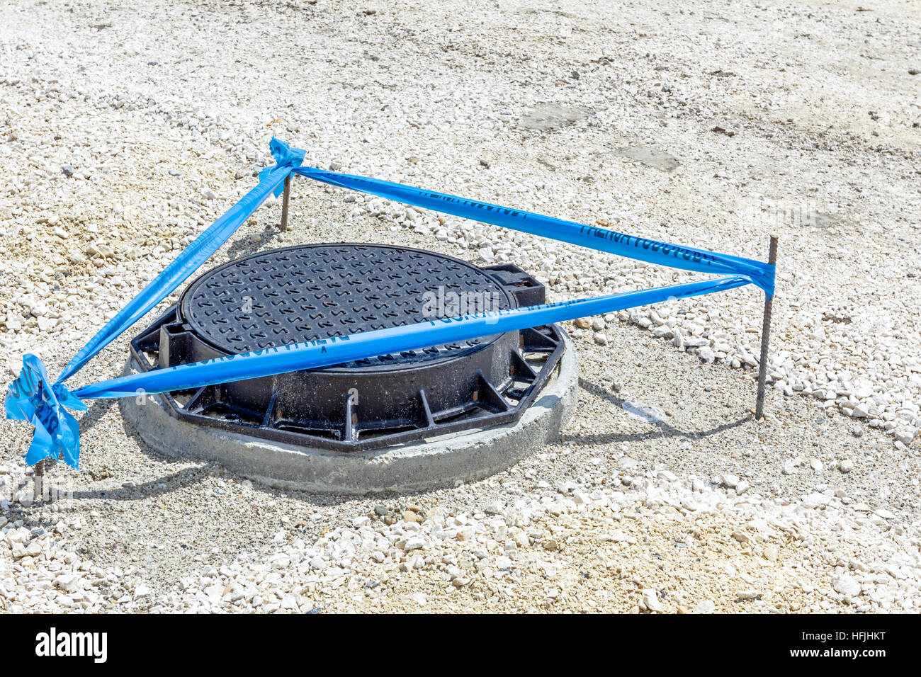 Three metal sticks with blue tape that is surrounding area around the ...