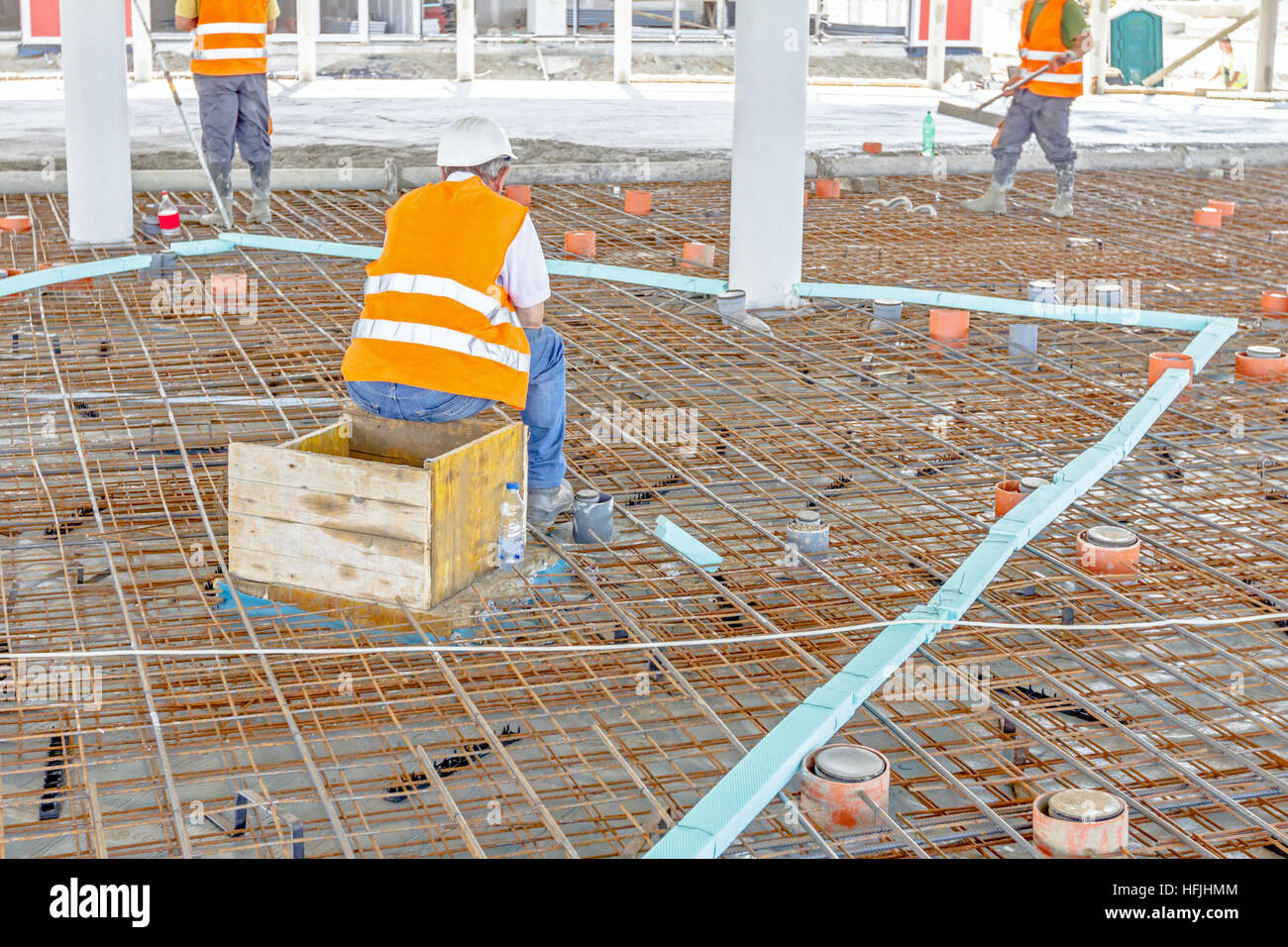 Break on building site, people are resting of spreading concrete over ...