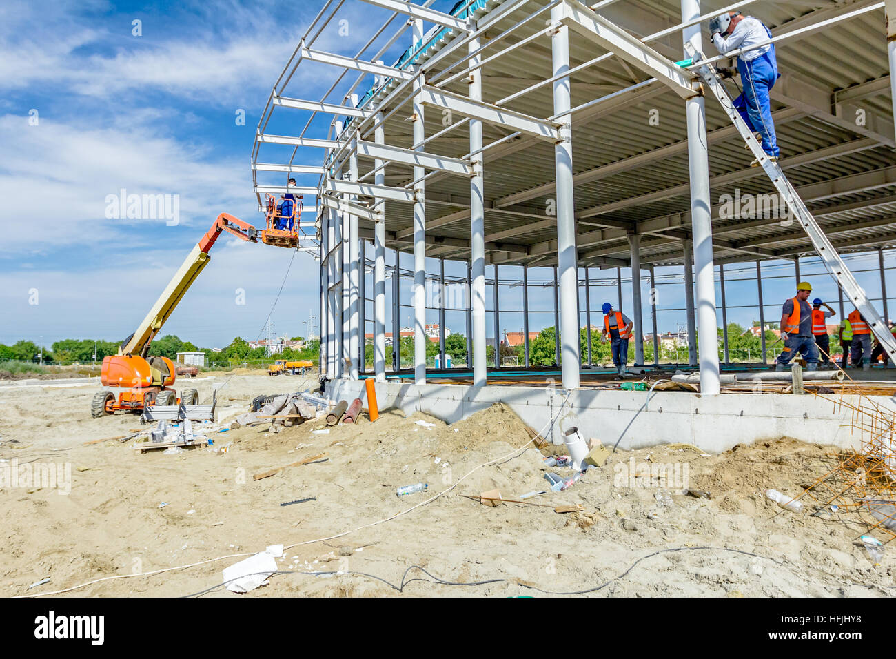 High elevated cherry picker people are working at new assembled ...