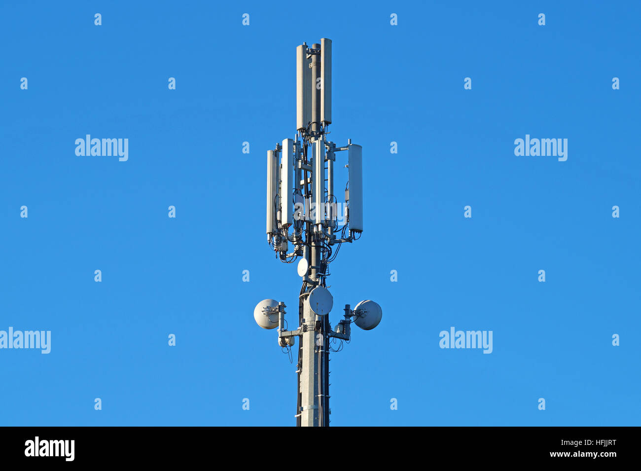 Modern Cellular Tower - Communication on Blue Sky. Vertical Photography ...