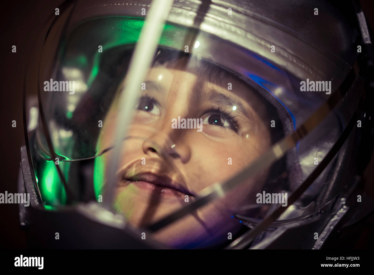 Science, Boy playing to be an astronaut with space helmet and metal ...