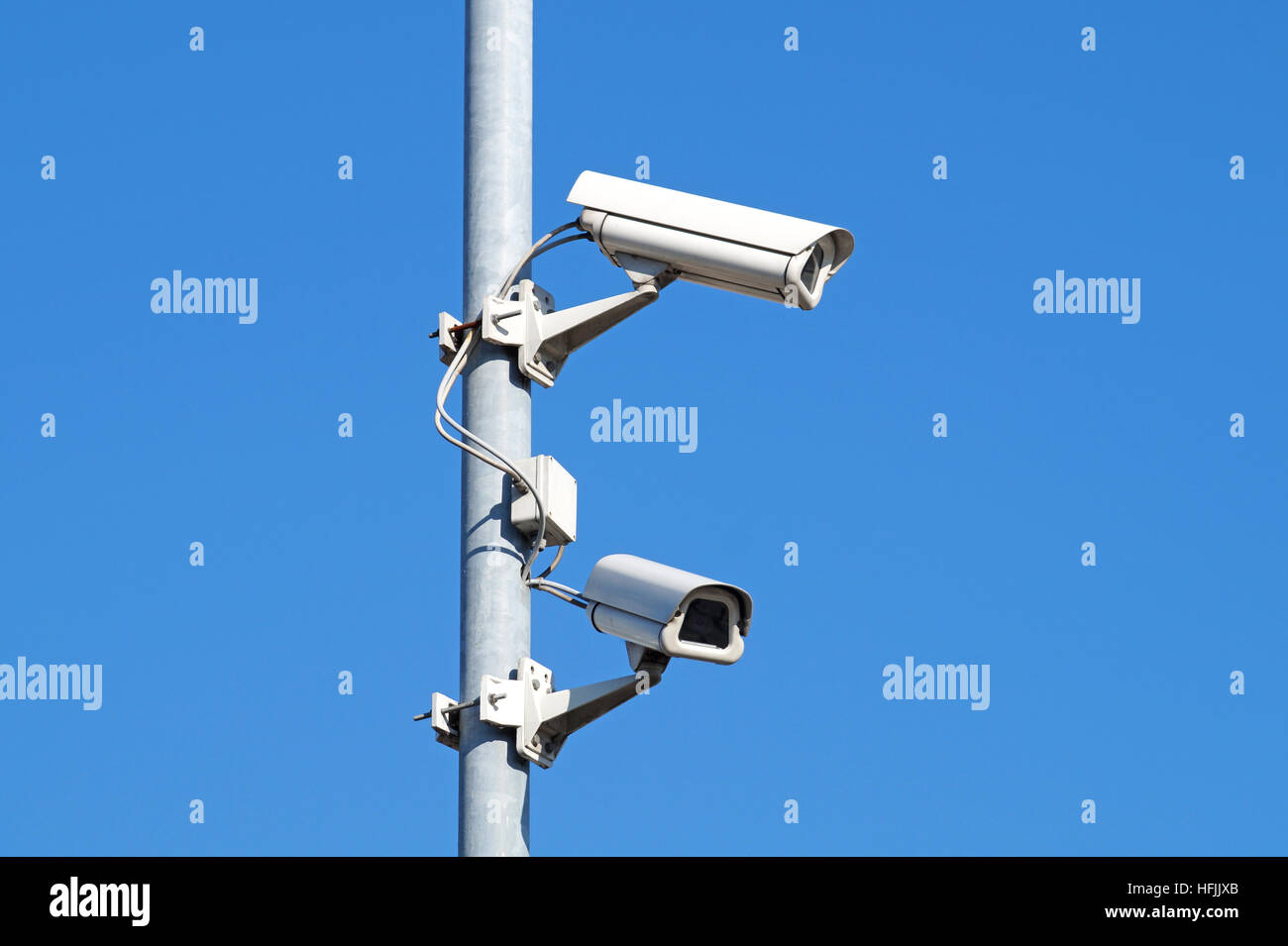 Surveillance cameras against blue sky Security Cctv Stock Photo - Alamy