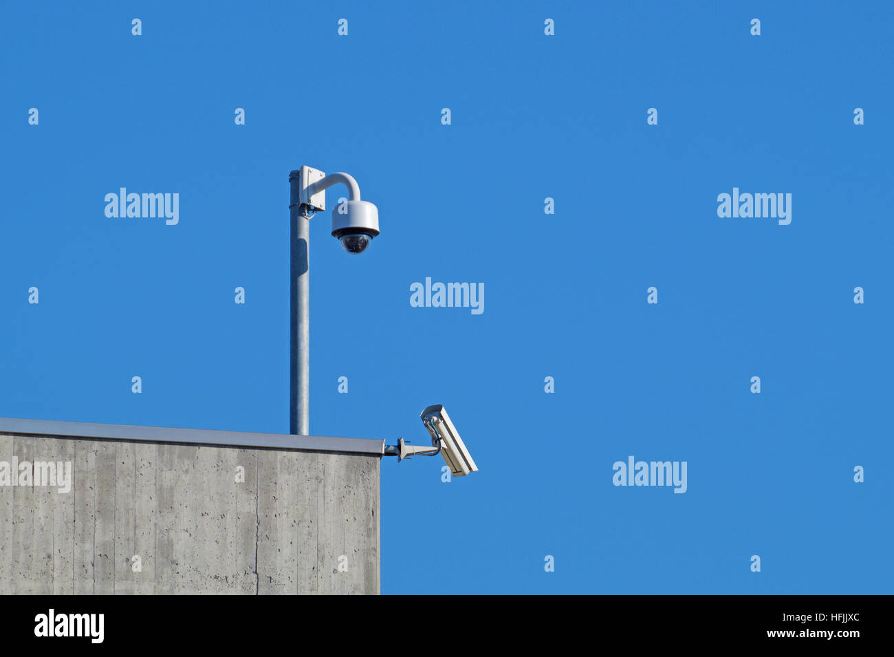 Surveillance cameras against blue sky Security Cctv Stock Photo - Alamy