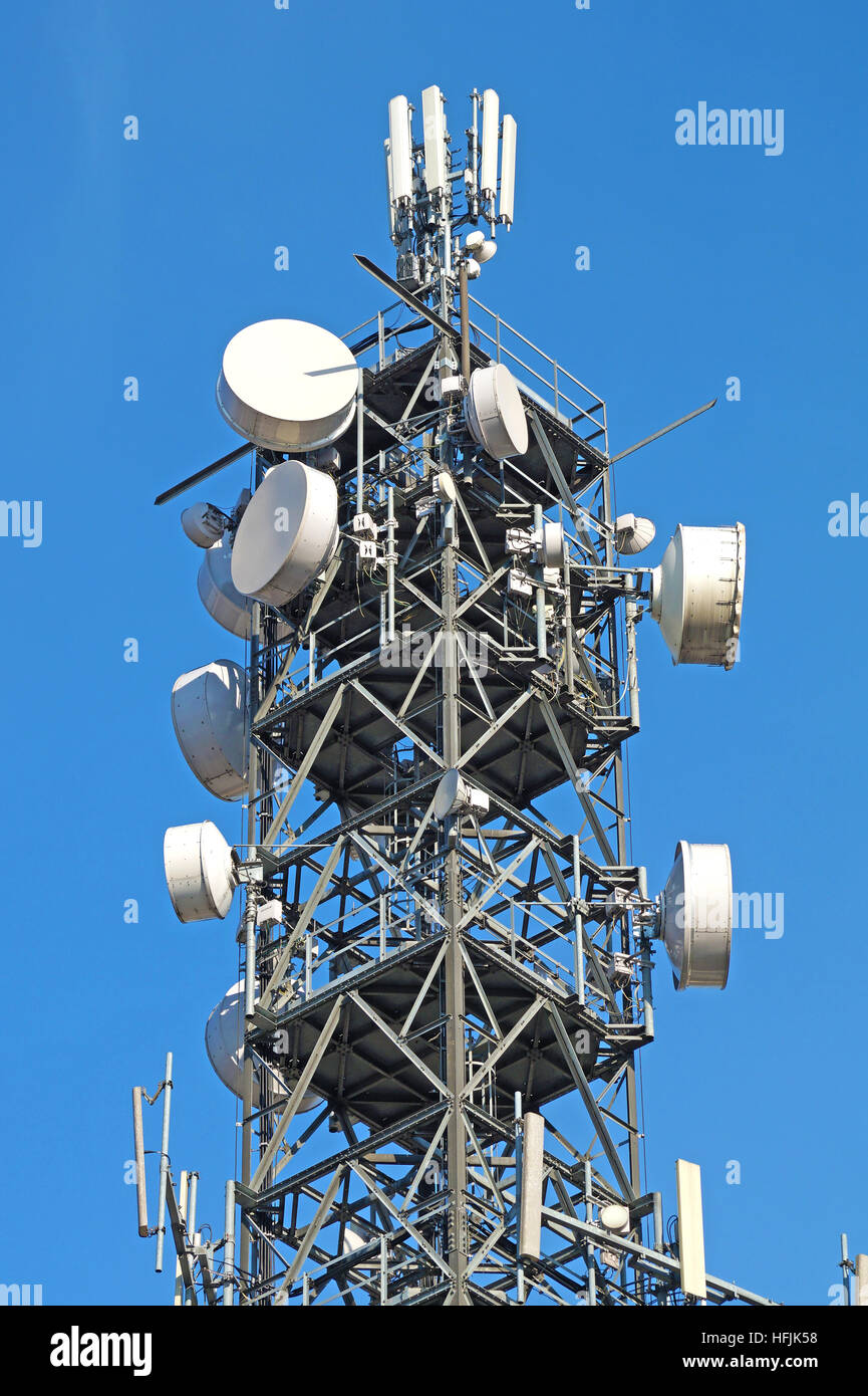 Telecommunication pole tower television antennas with blue sky Stock ...
