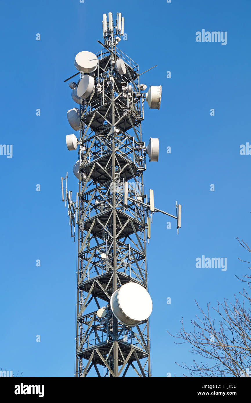 Telecommunication pole tower television antennas with blue sky Stock ...